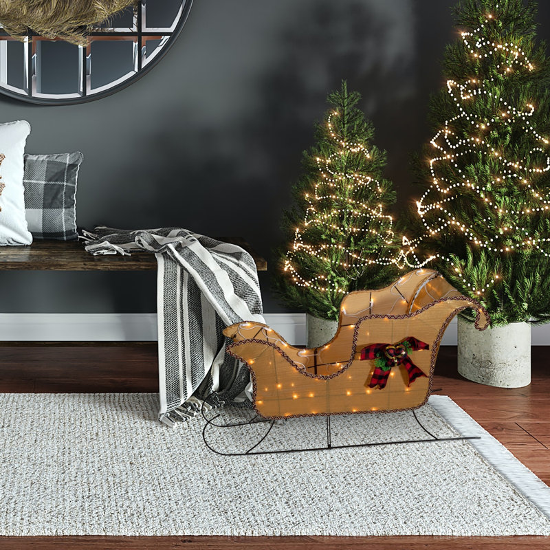 The Holiday Aisle® Sleigh Figurine Shiny Gold Sleigh Christmas ...