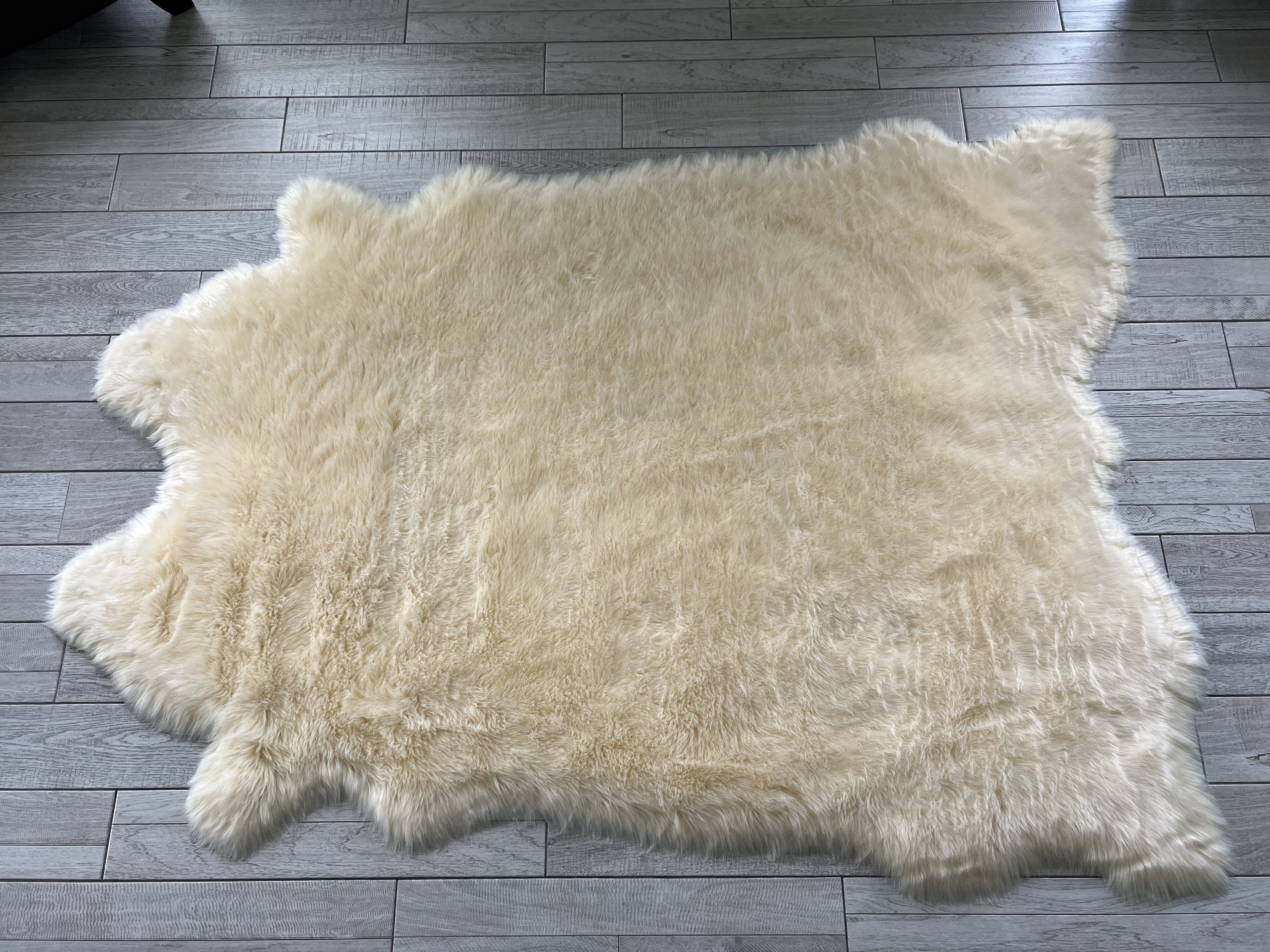 Spectrum Rugs Faux Bison Skin Fur Shag Area Rug in Cream | Wayfair