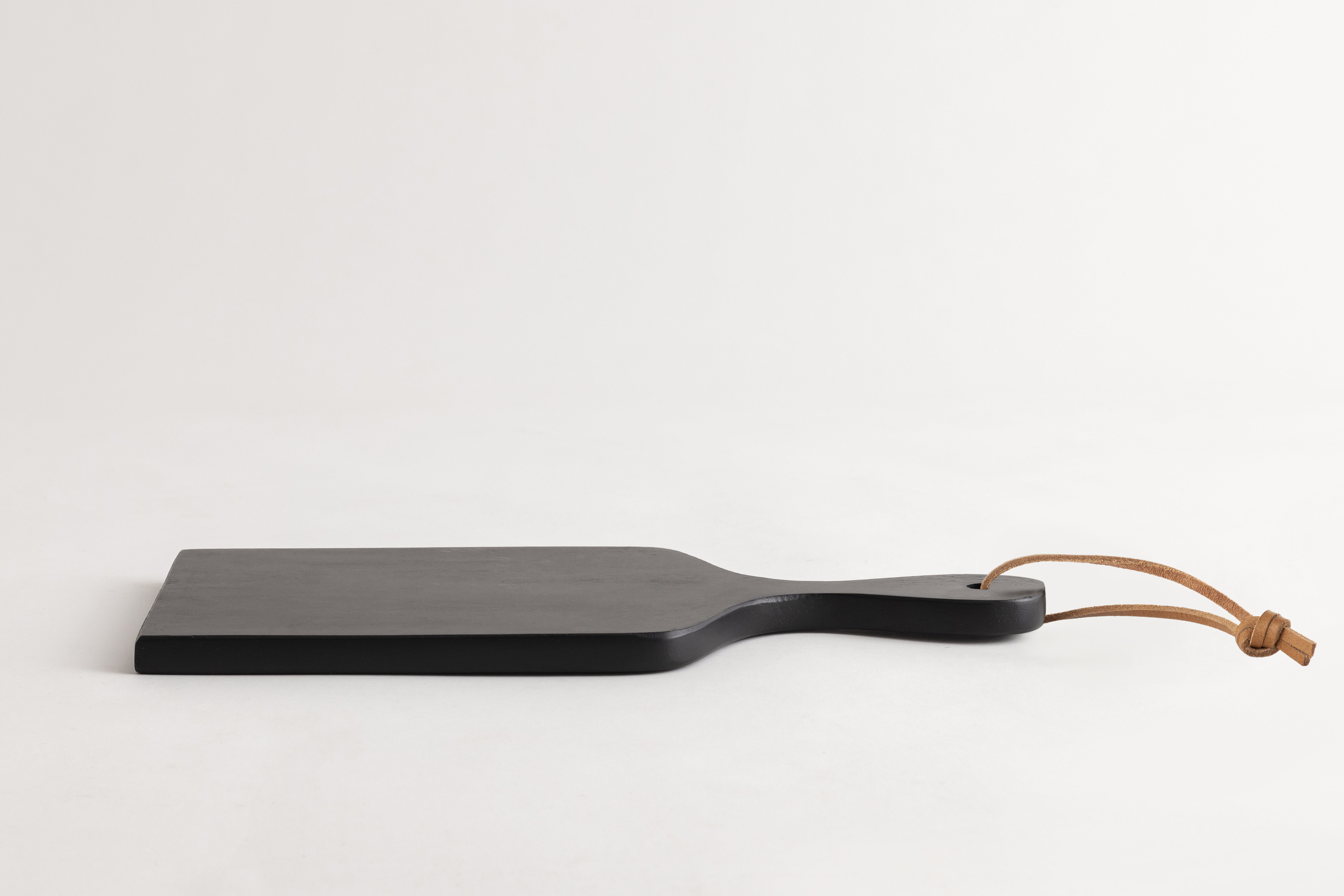 The Design House Noir Chopping Board with sleek handle | Wayfair
