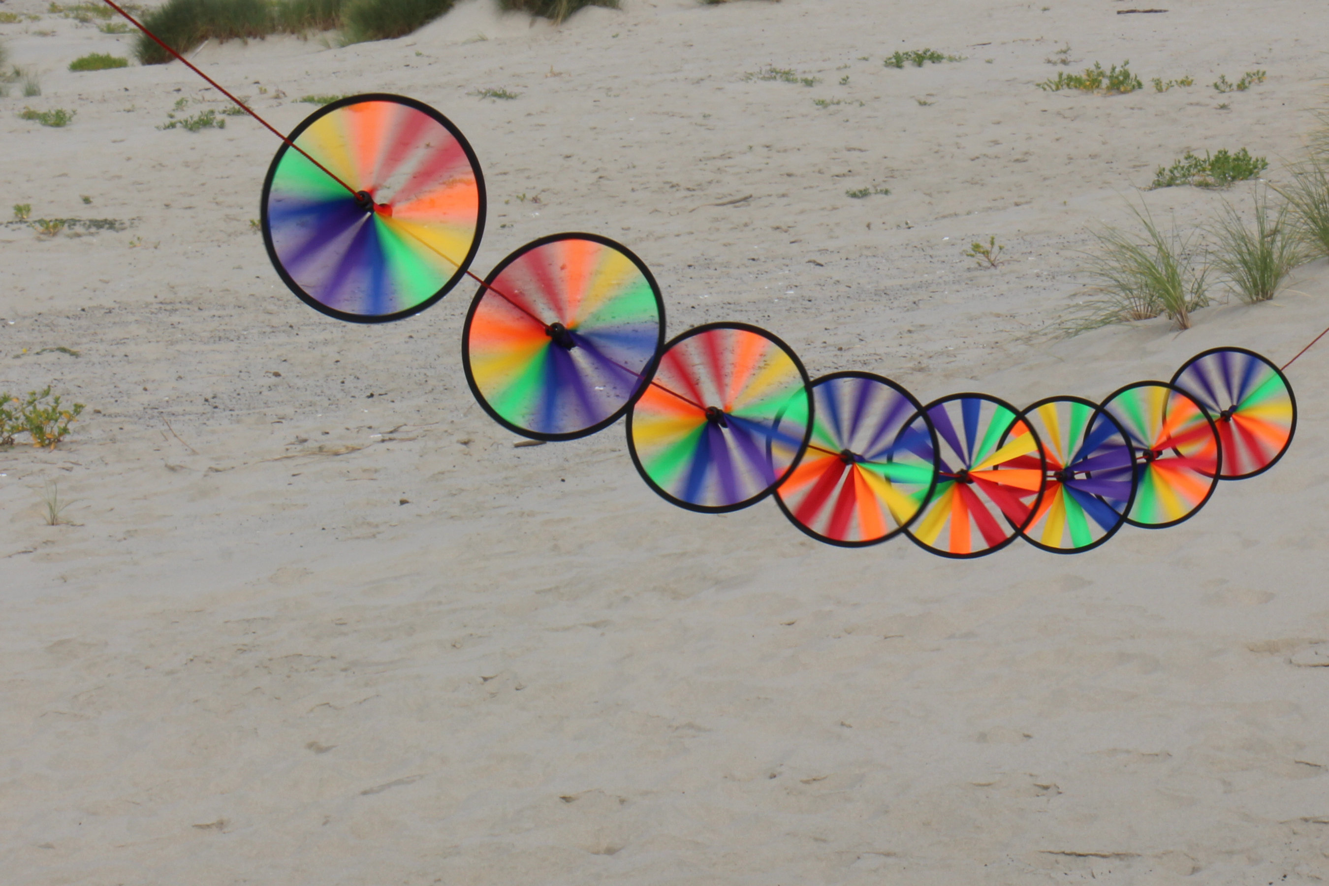 In The Breeze Spinner Wheels on String | Wayfair