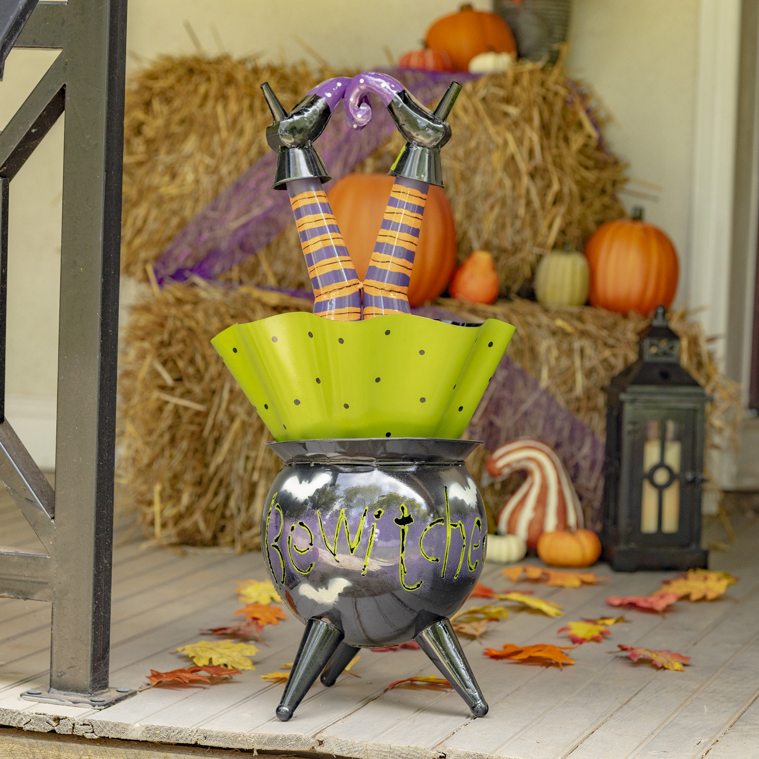 The Holiday Aisle® Bewitched Cauldron witch Legs Figurine | Wayfair
