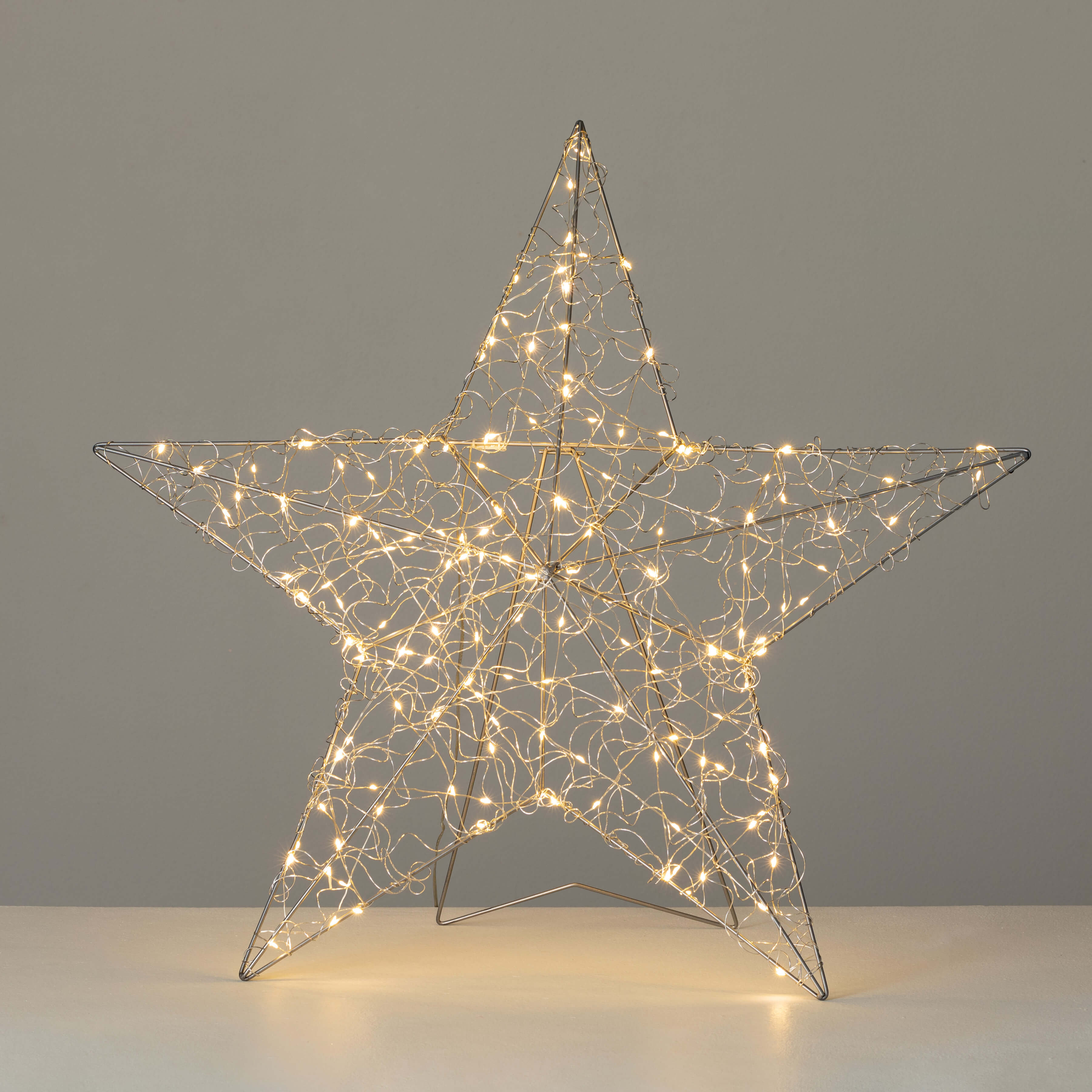 The Holiday Aisle® 31.5" Christmas Silver Lighted Star With Stand ...