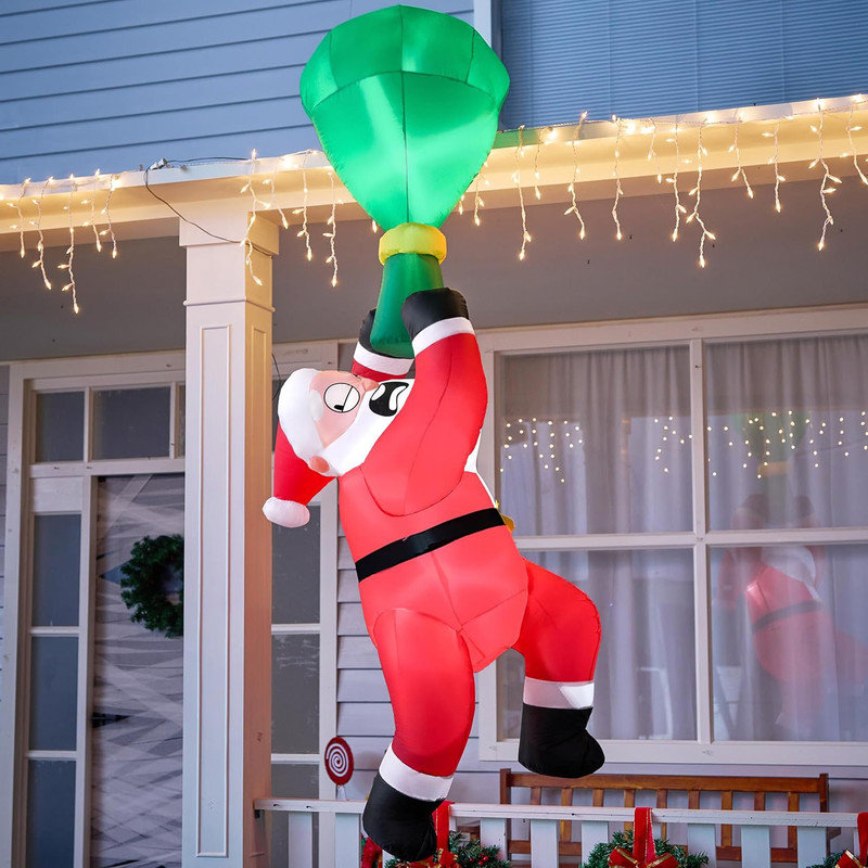 The Holiday Aisle® Tall Christmas Inflatable Falling Santa with Gift ...
