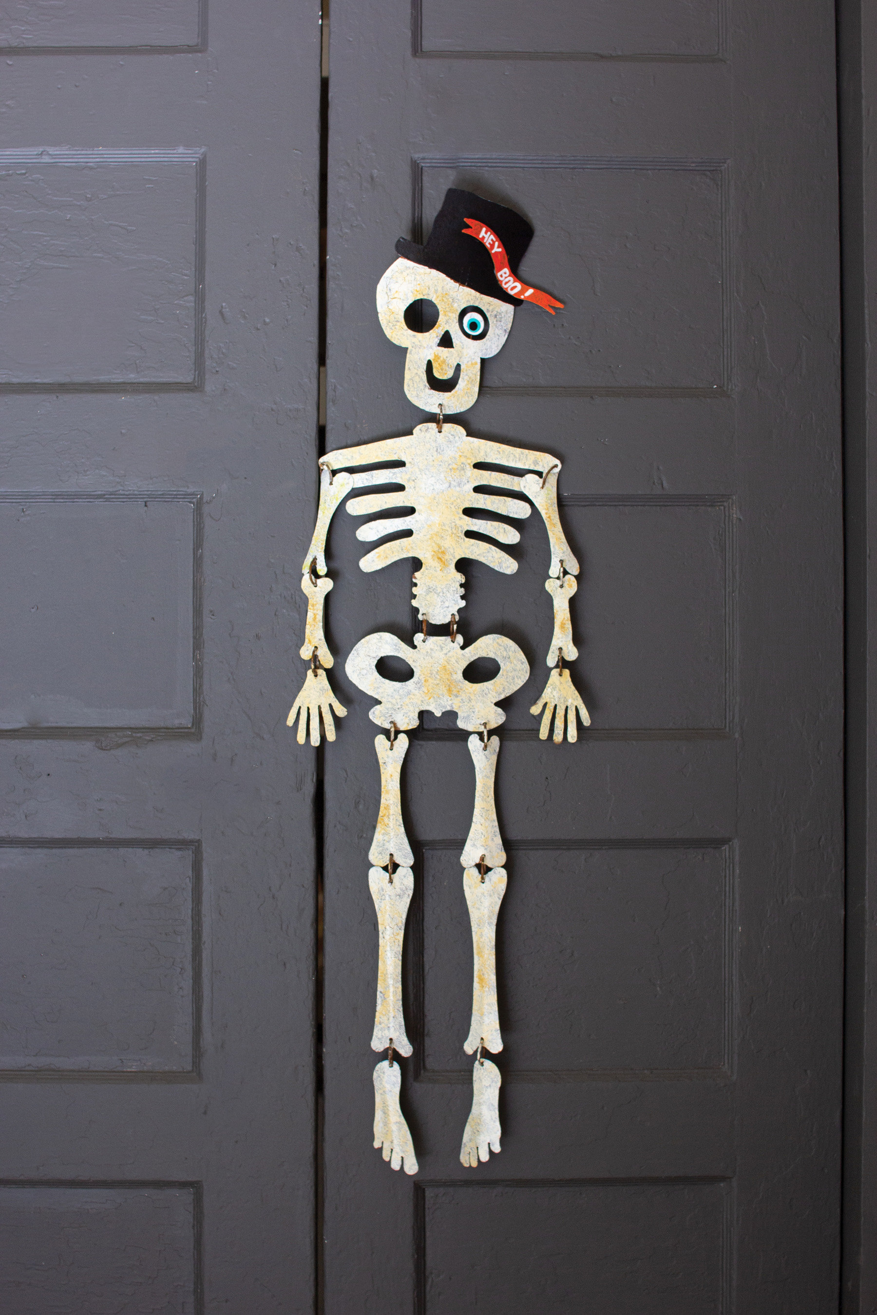 The Holiday Aisle® PAINTED METAL SKELETON DOOR ART | Wayfair