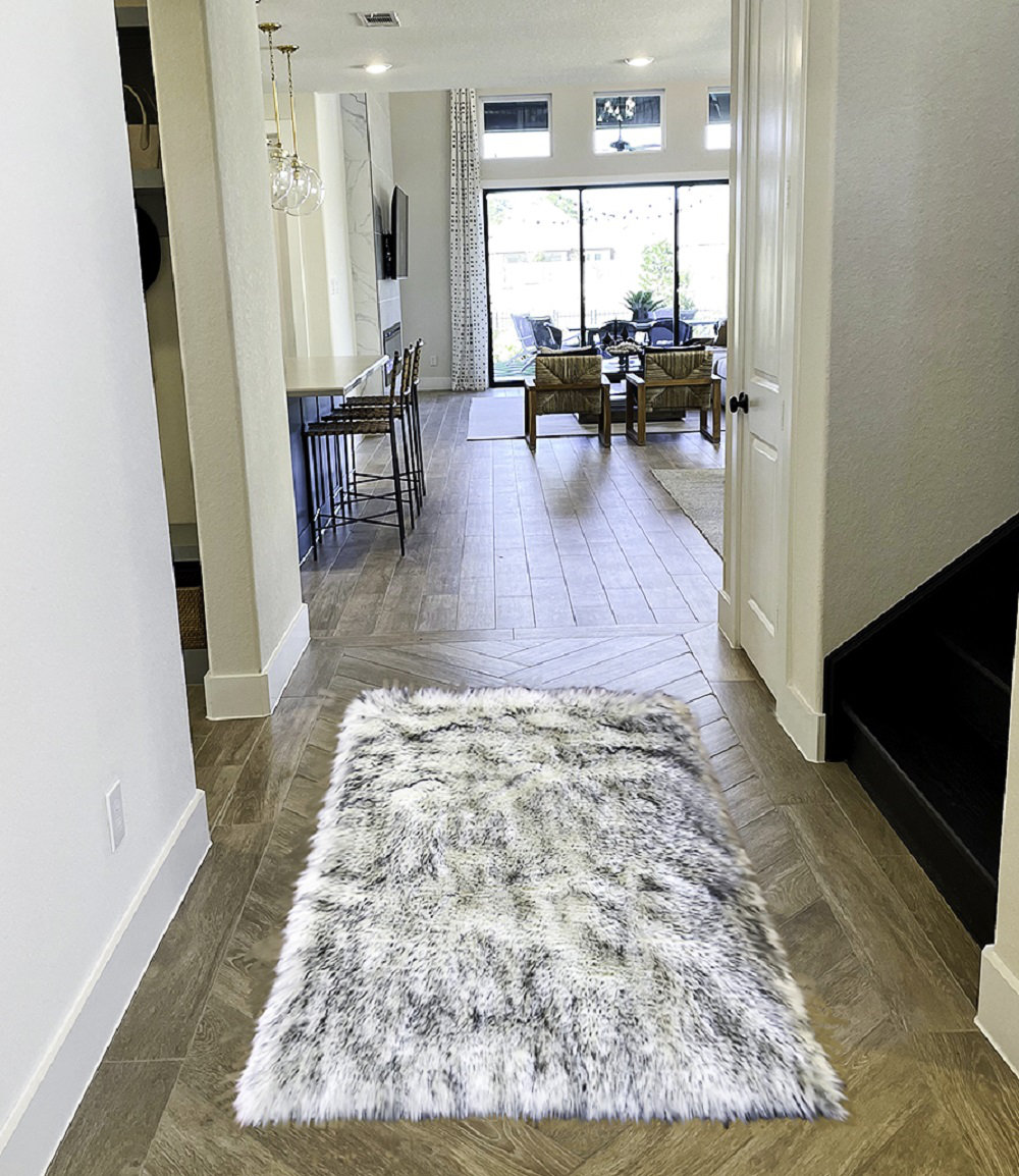 Everly Quinn Eternity Shag Faux Sheepskin Rug In White/Black - Wayfair ...