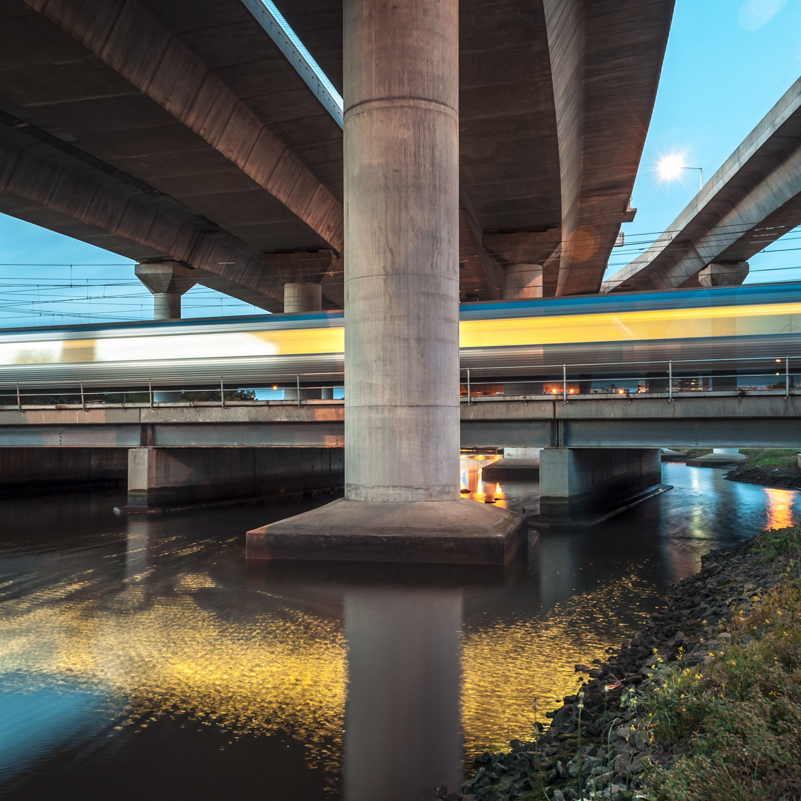 Hokku Designs Christlyn Train Crossing Under Freeway On Canvas by ...