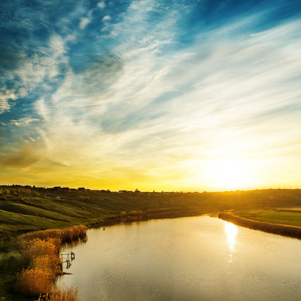 Ebern Designs Loette Orange Sunset Over River by - Wrapped Canvas ...