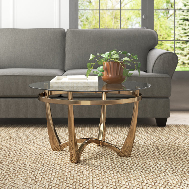 Lark Manor Clapton Cross Legs Coffee Table in Champagne and Clear ...