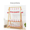 Rebrilliant Nashiem 26" W Clothing Garment Rack Clothes Rack Wooden ...