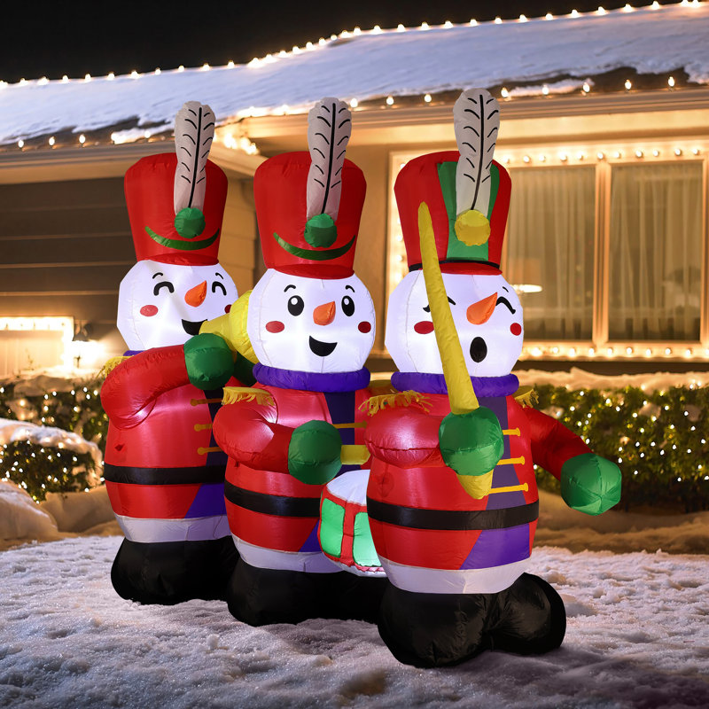 The Holiday Aisle® 8.2 Ft Long Toy Soldier Snowman Trio Inflatable with ...