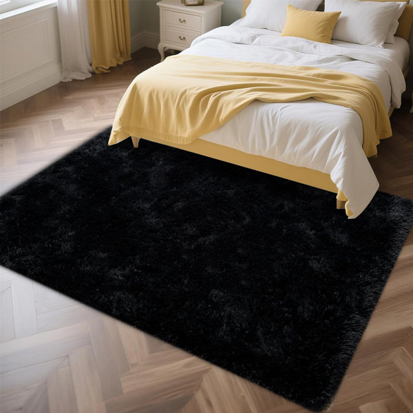 Mercer41 Soft black shag area rug | Wayfair