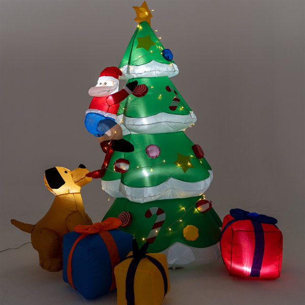 The Holiday Aisle® Christmas Tree with a Santa Chased Inflatable ...