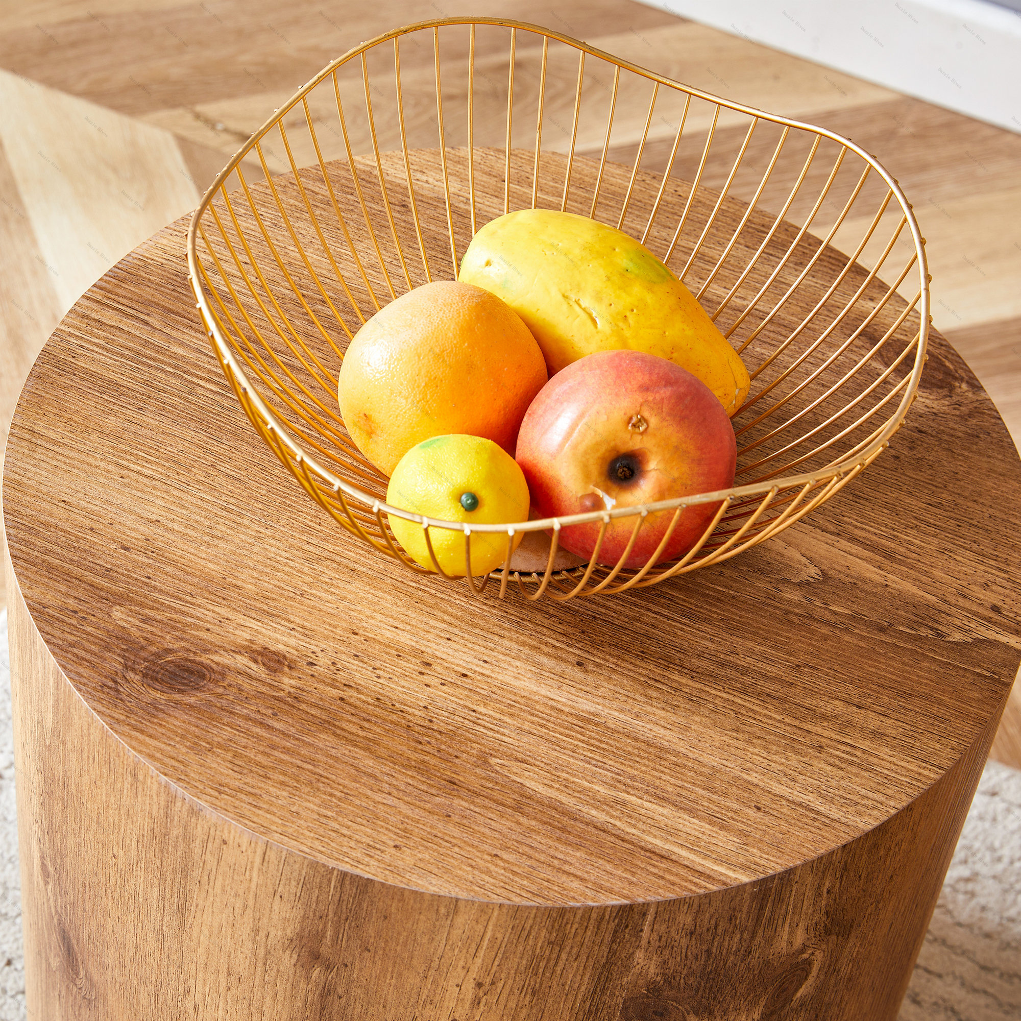 Millwood Pines The cylindrical table with its patterned design can be ...