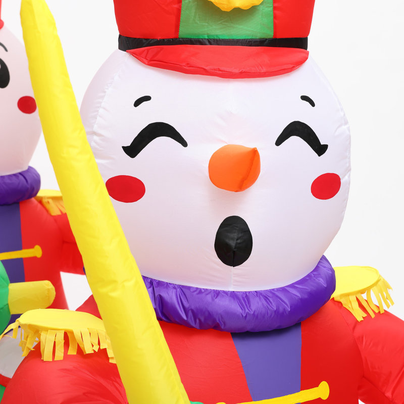 The Holiday Aisle® 8.2 Ft Long Toy Soldier Snowman Trio Inflatable with ...