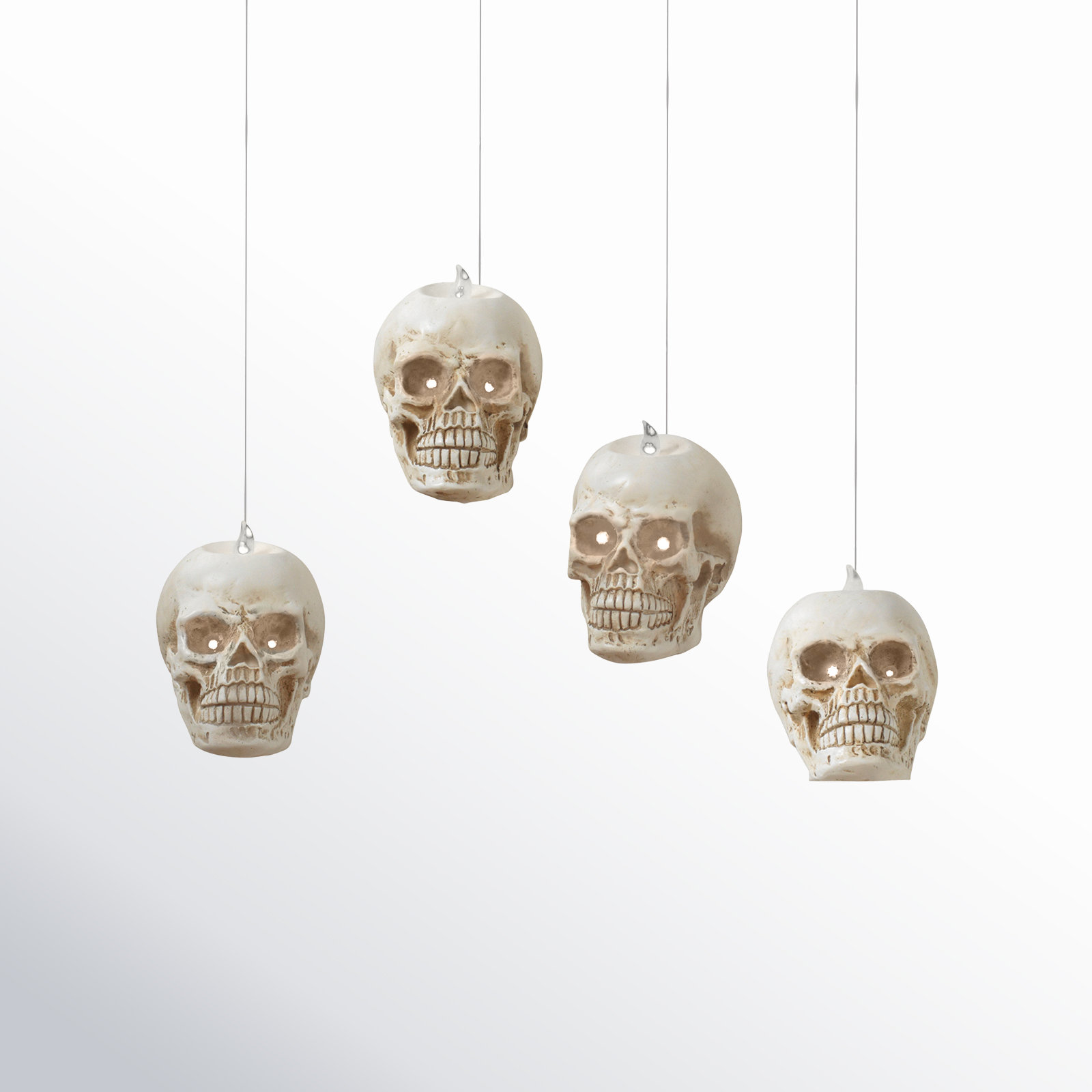The Holiday Aisle® Set Of 4 Battery Operated Resin Hanging Skull Appear ...