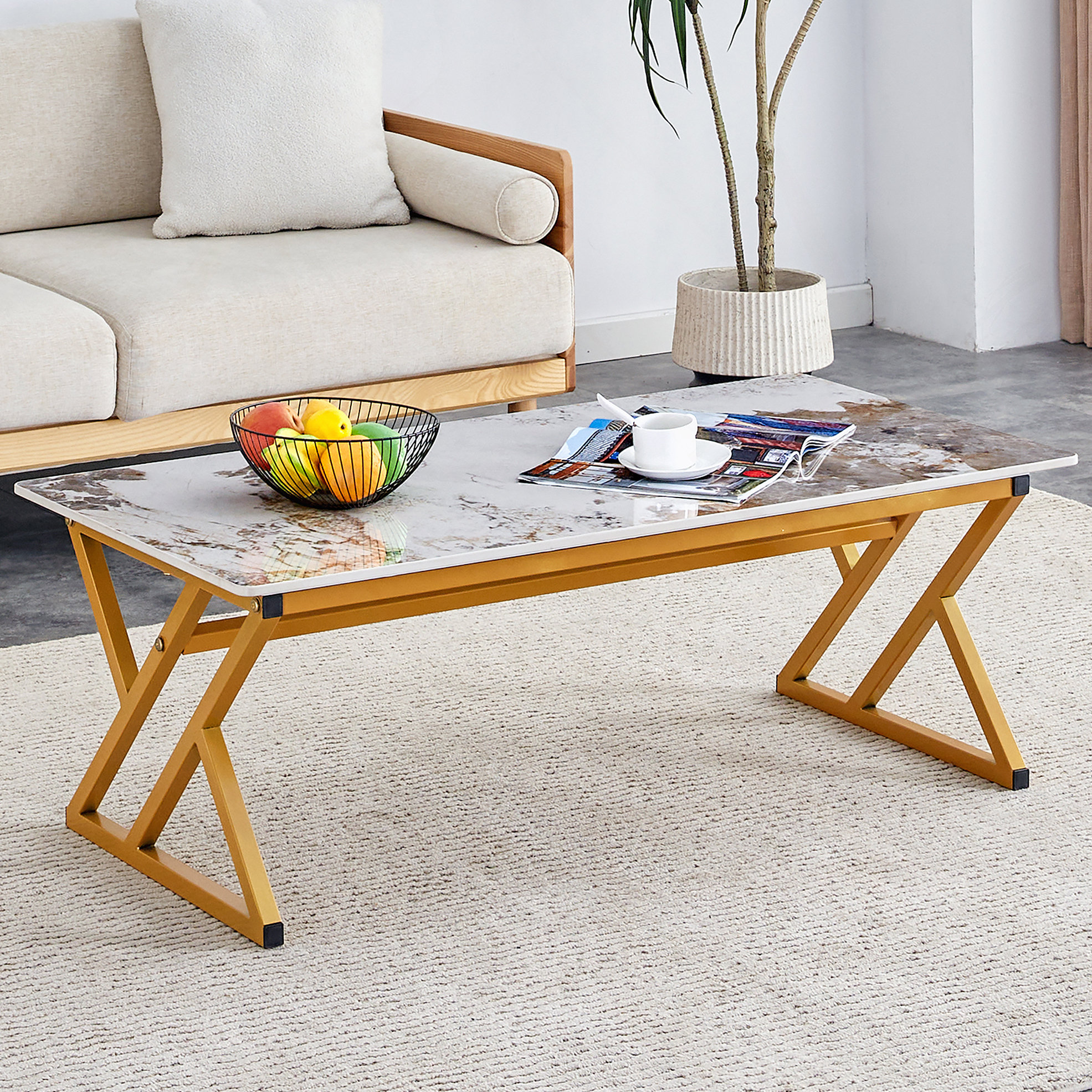 Wrought Studio™ A coffee table is made of rock slab material, with a ...