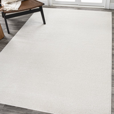 Wade Logan Autin Solid Color Machine Woven Polyester Area Rug in Ivory ...