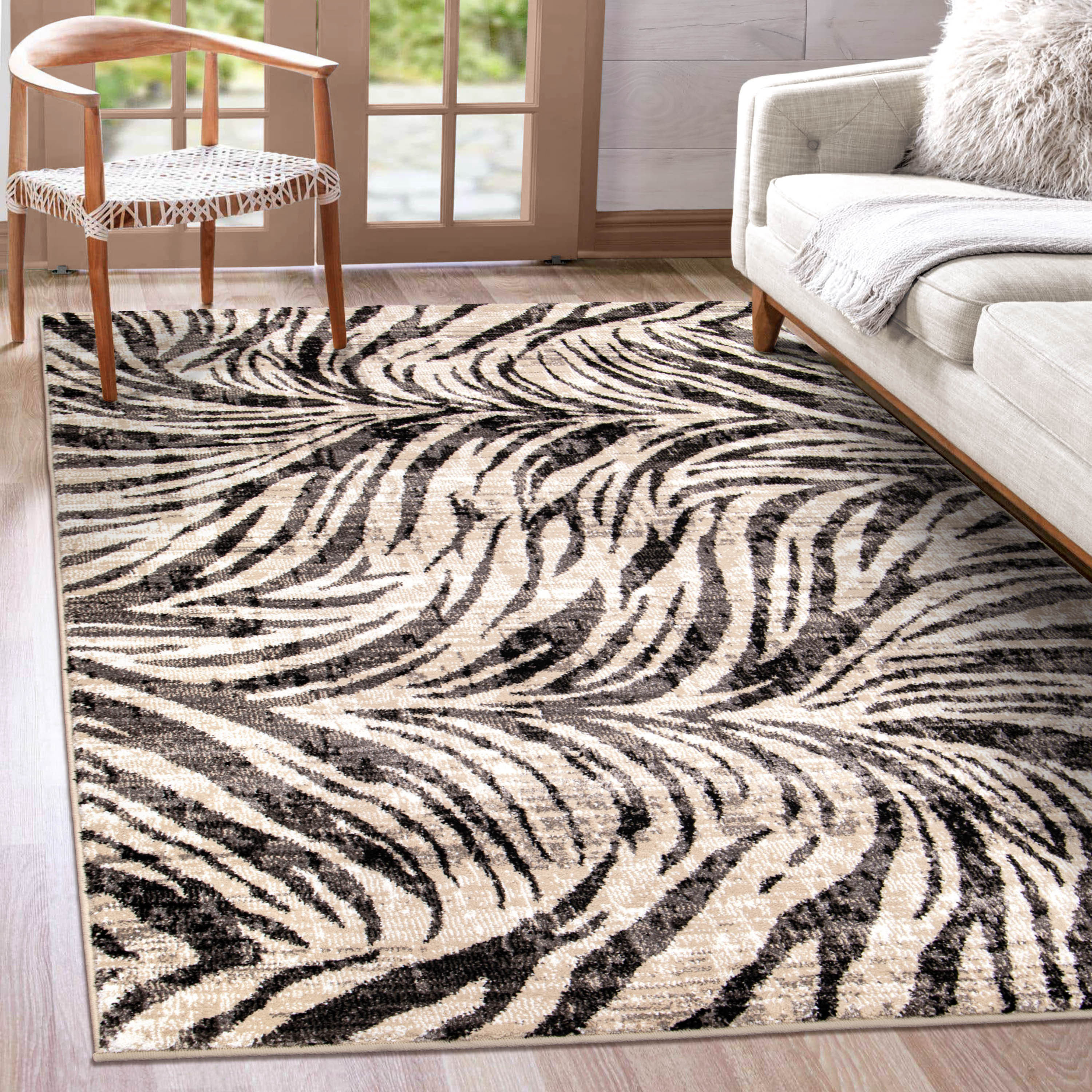17 Stories Owetta Animal Print Black Stain Resistant Area Rug | Wayfair