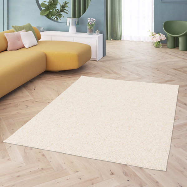 17 Stories Masum Solid Colour Machine Woven Machine Tufted Cream Area ...