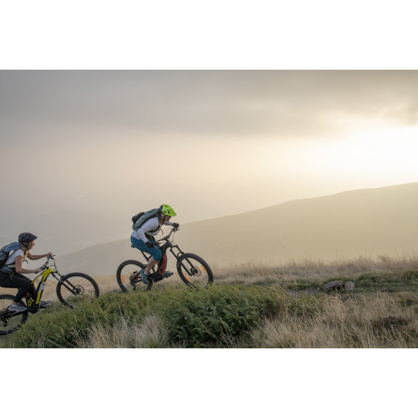 Alpen Home Two Women Ride Up Grassy Hillside by AscentXmedia - No Frame ...