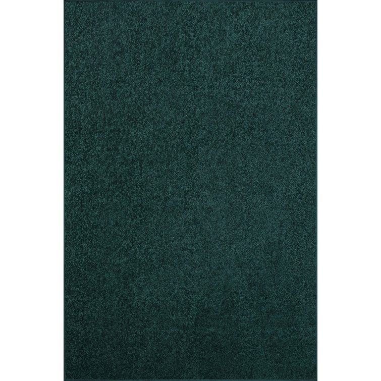 solid dark green area rug