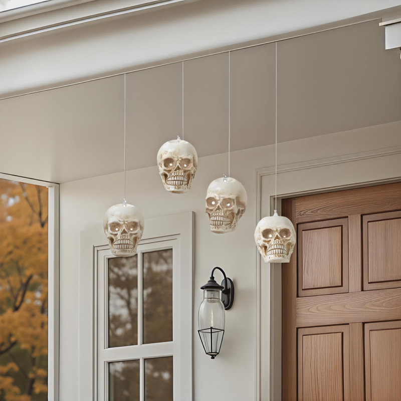 The Holiday Aisle® Set Of 4 Battery Operated Resin Hanging Skull Appear ...
