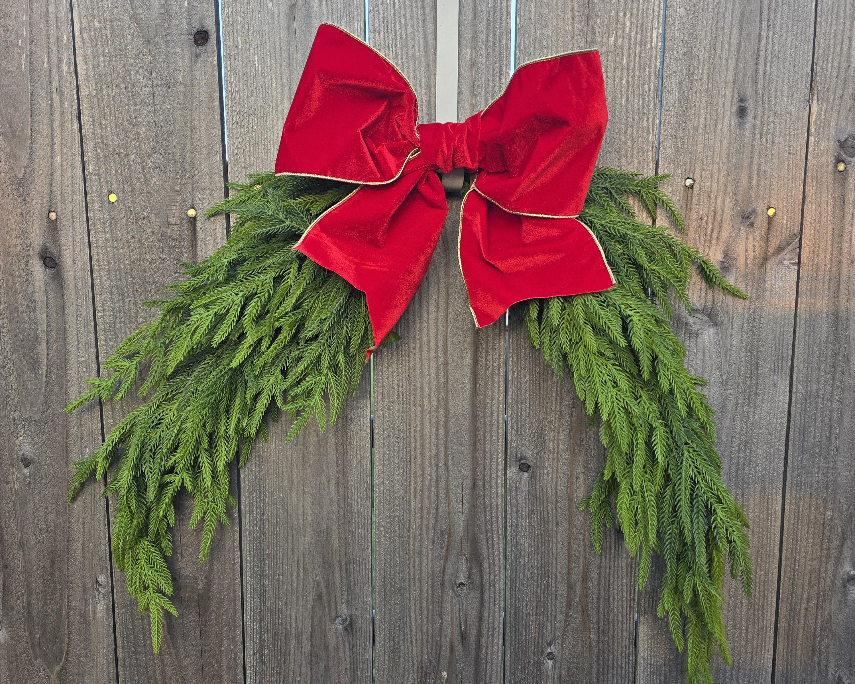 The Holiday Aisle® Norfolk Pine Swag With Red Bow | Wayfair