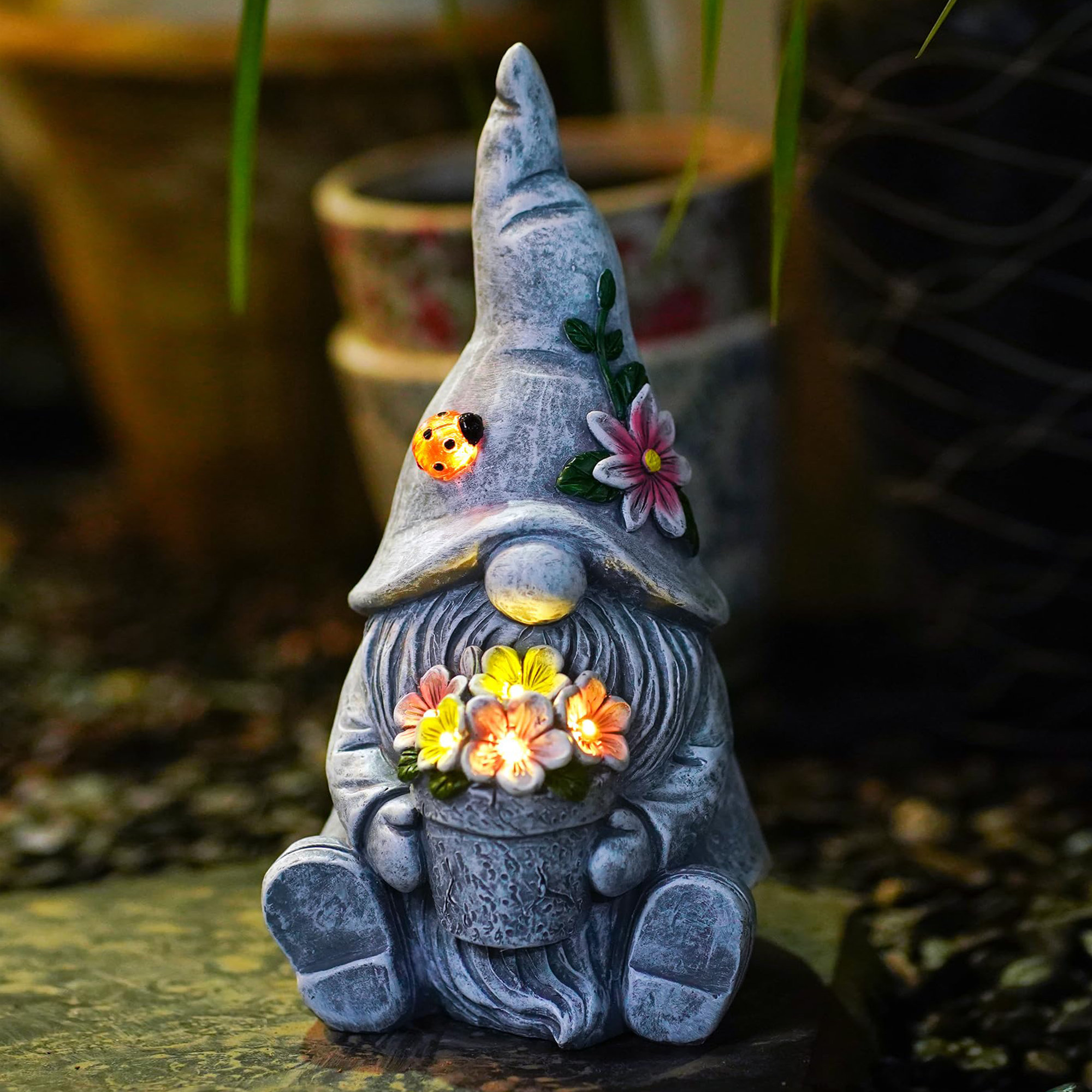 Trinx Seated Gnome Statue Holding Flower, Solar Powered Garden Gnome ...