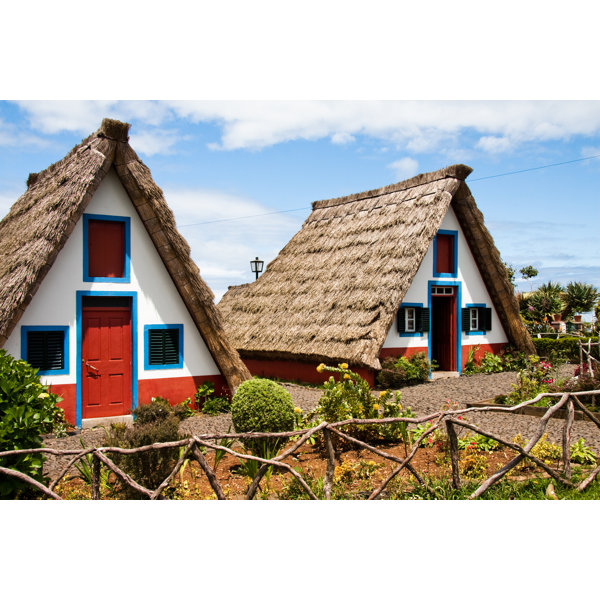 Ebern Designs Thatched Roof Houses On Canvas by Rallef Print | Wayfair