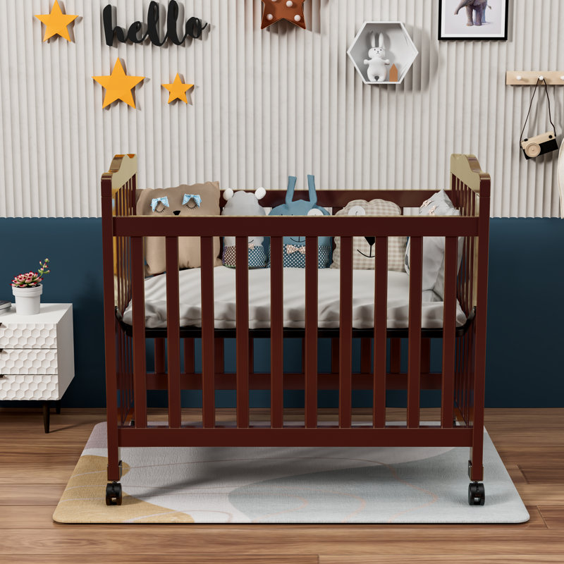 Harriet Bee Hinojosa Mini Crib With 3 Position Adjustable Mattress ...