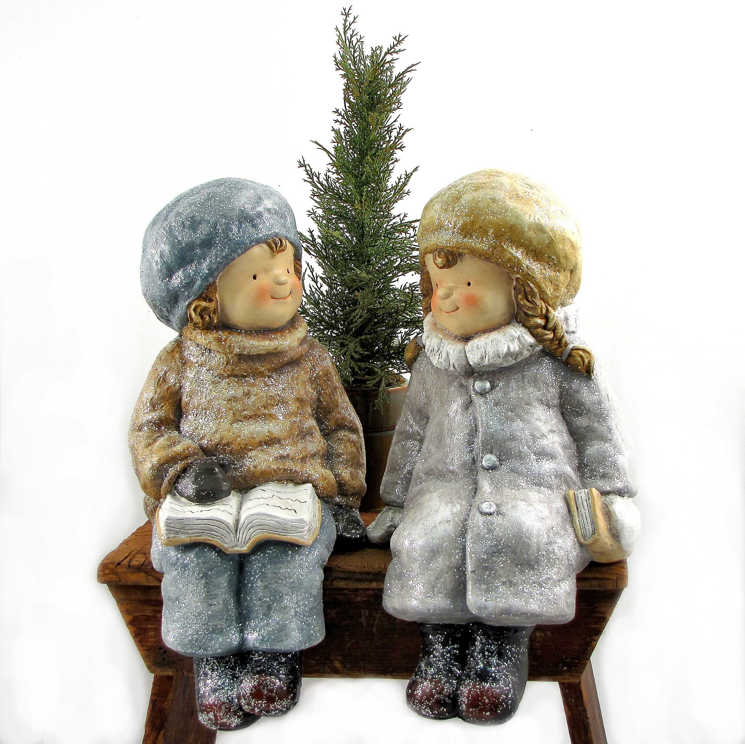 The Holiday Aisle® Holiday Children Sitting with Books (Boy and Girl ...