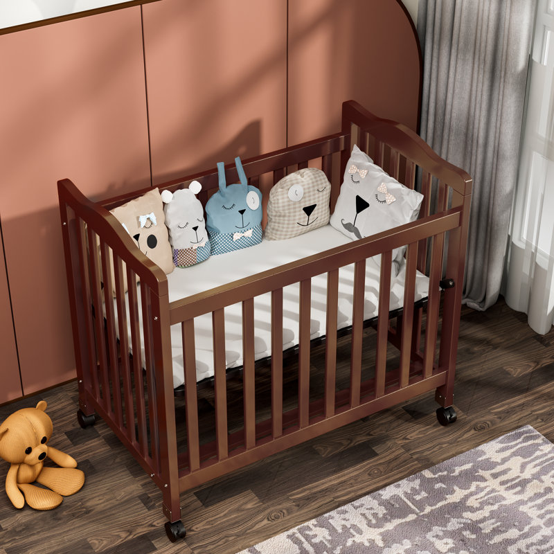 Harriet Bee Hinojosa Mini Crib With 3 Position Adjustable Mattress ...