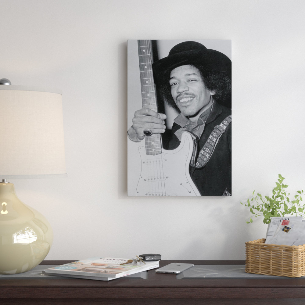 Bless international A Smiling Jimi Hendrix Holding His Guitar by Radio ...