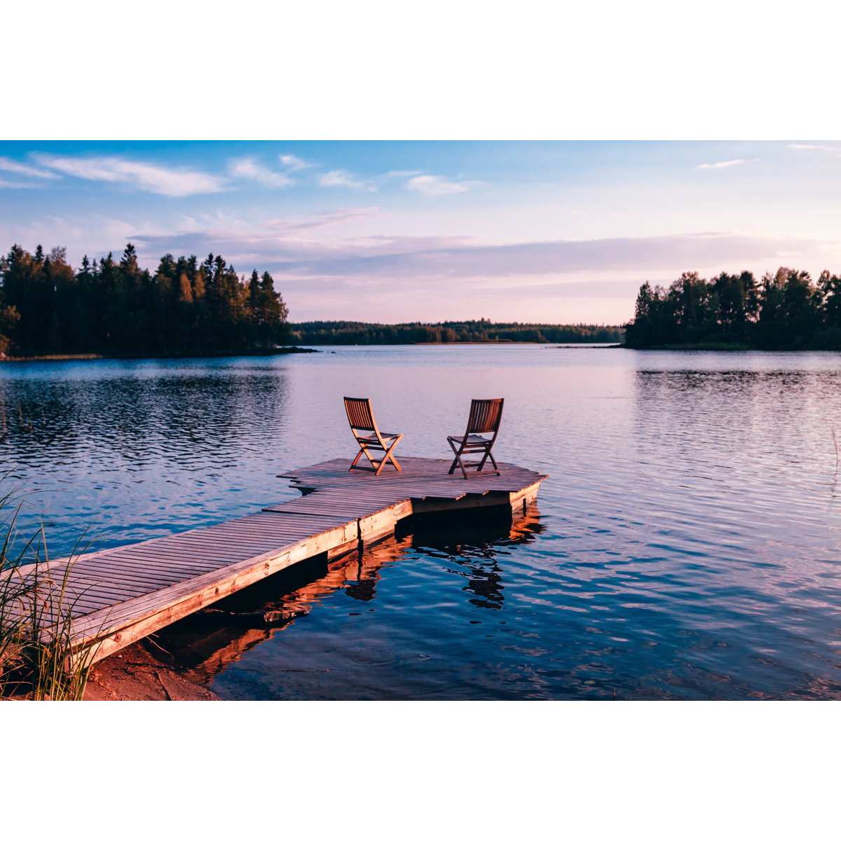 Ebern Designs Two Wooden Chairs On A Wood Pier Overlooking A Lake At ...