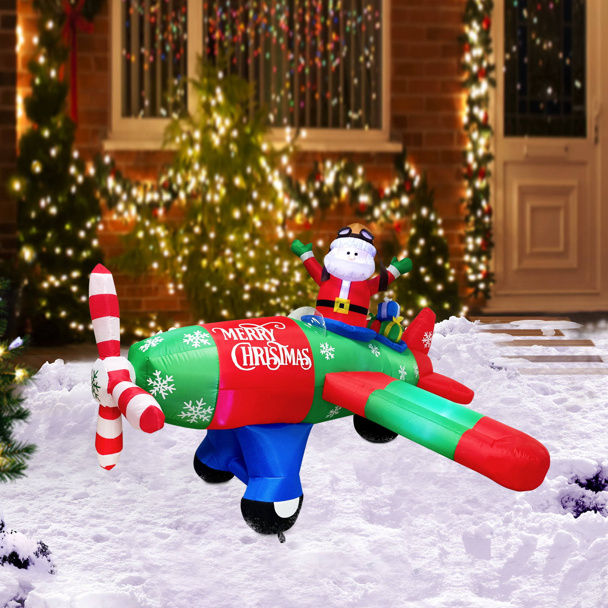 The Holiday Aisle® Santa Flies a Plane Inflatable | Wayfair