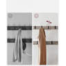 17 Stories A Grey-Brown And Black Coat Rack, An Entryway Coat Rack With ...