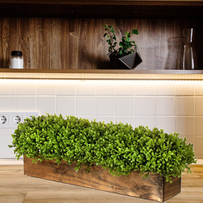 faux plants in rectangular planter