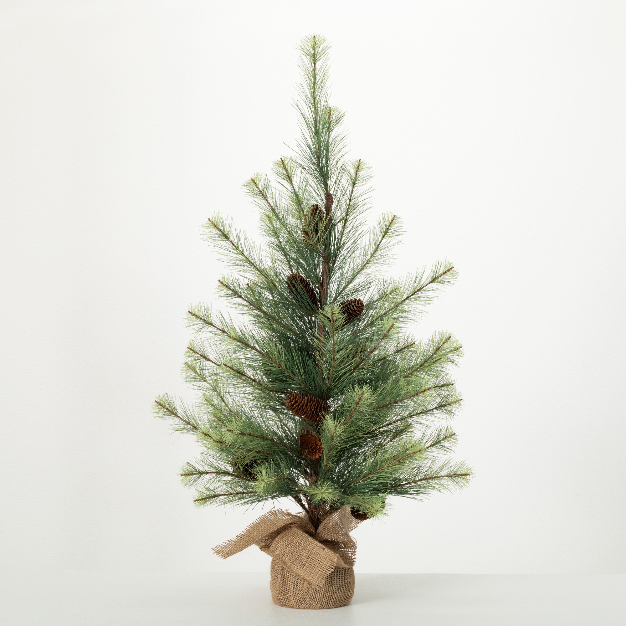 The Holiday Aisle® Stallings Faux Pine Tree in Rattan Pot | Wayfair