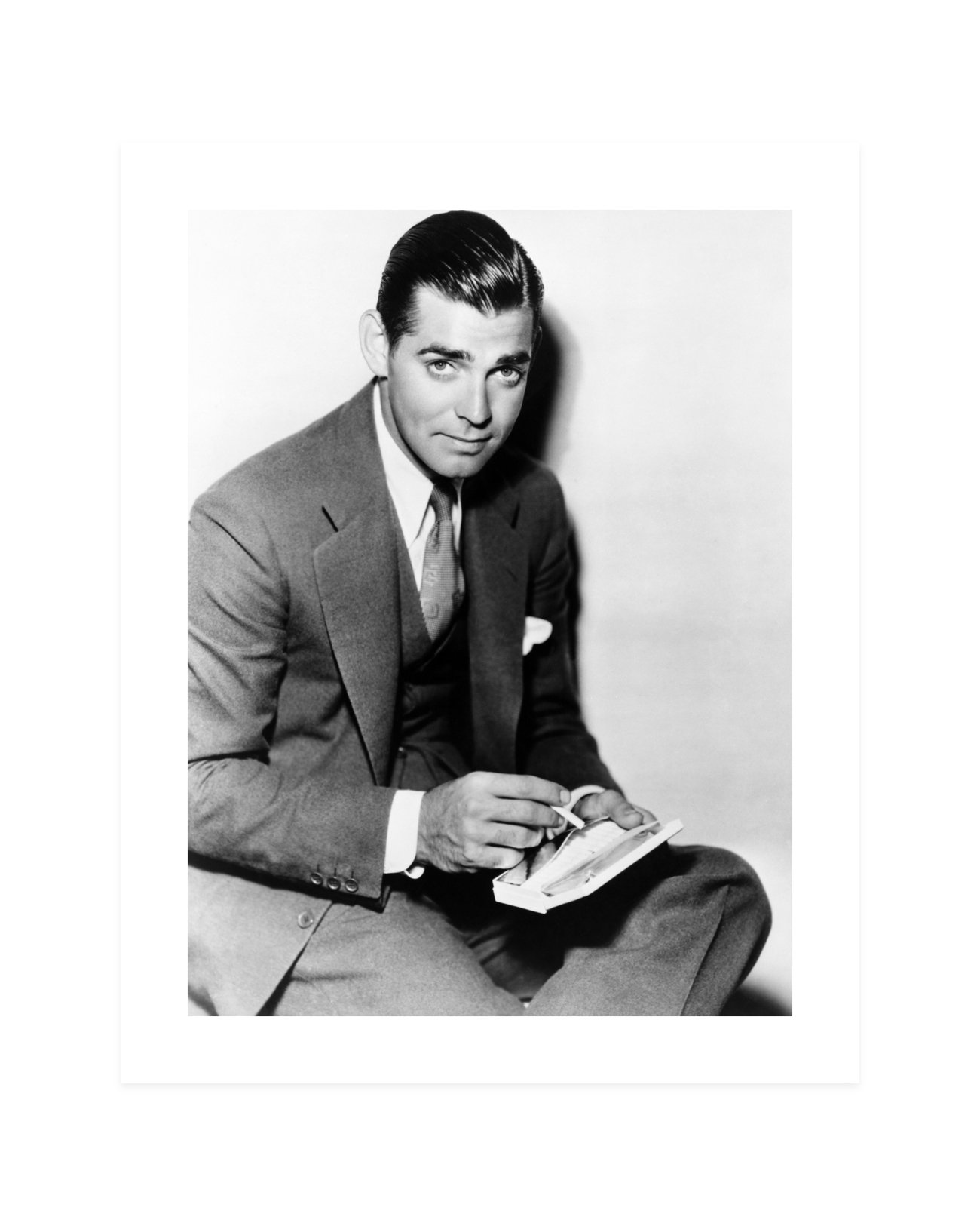 Globe Photos Entertainment & Media Portrait of Clark Gable Holding a ...