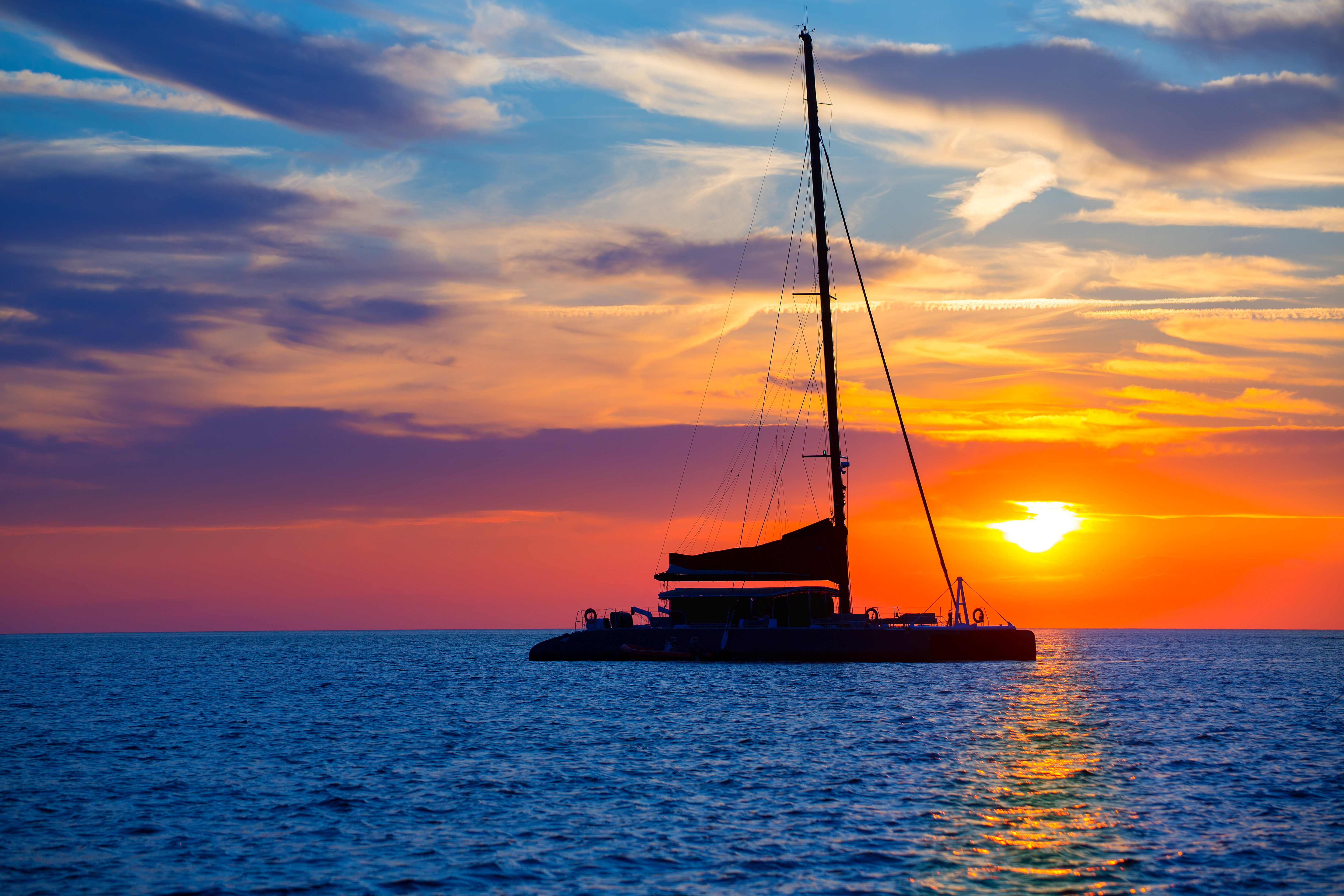 Breakwater Bay Catamaran Sailboat Sunset by Lunamarina - Wrapped Canvas ...