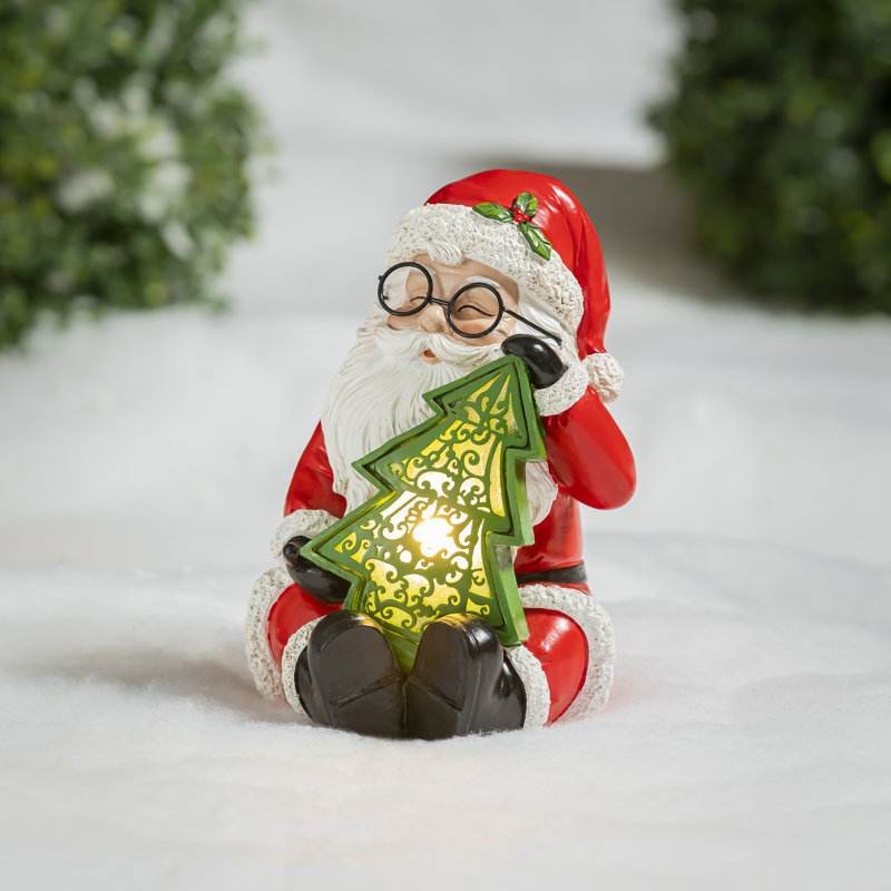 The Holiday Aisle® Jaxsten Holiday Santa Garden Statue with LED Tree ...