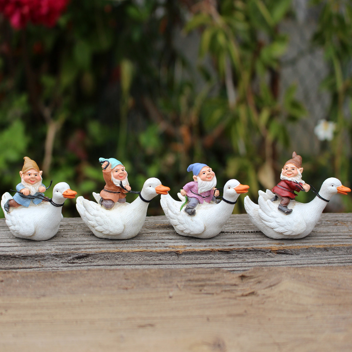Trinx 4 Piece Racing ducks garden gnome Statues Set | Wayfair