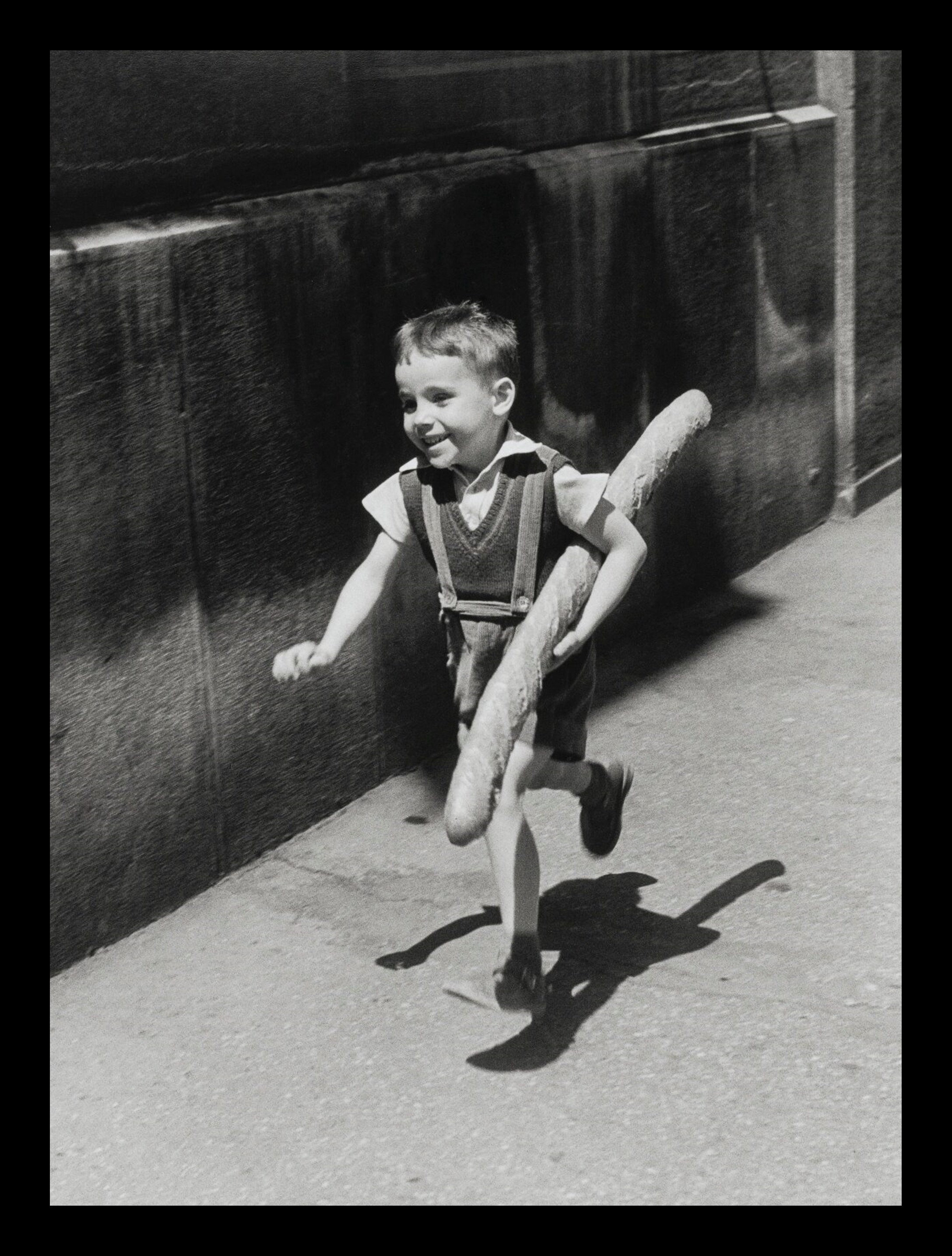 Ebern Designs France Boy Running with Big Loaf by Willy Ronis - Picture ...
