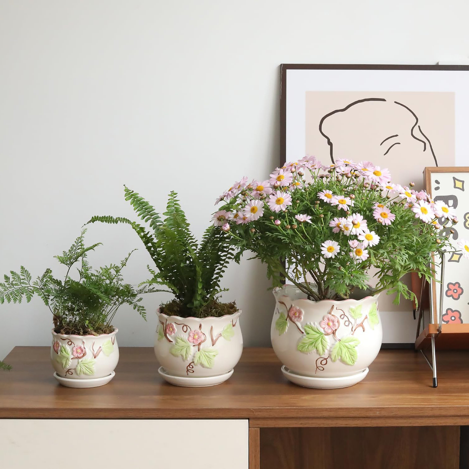 Lark Manor A set of 3 ceramic planters with hand-painted flower designs ...