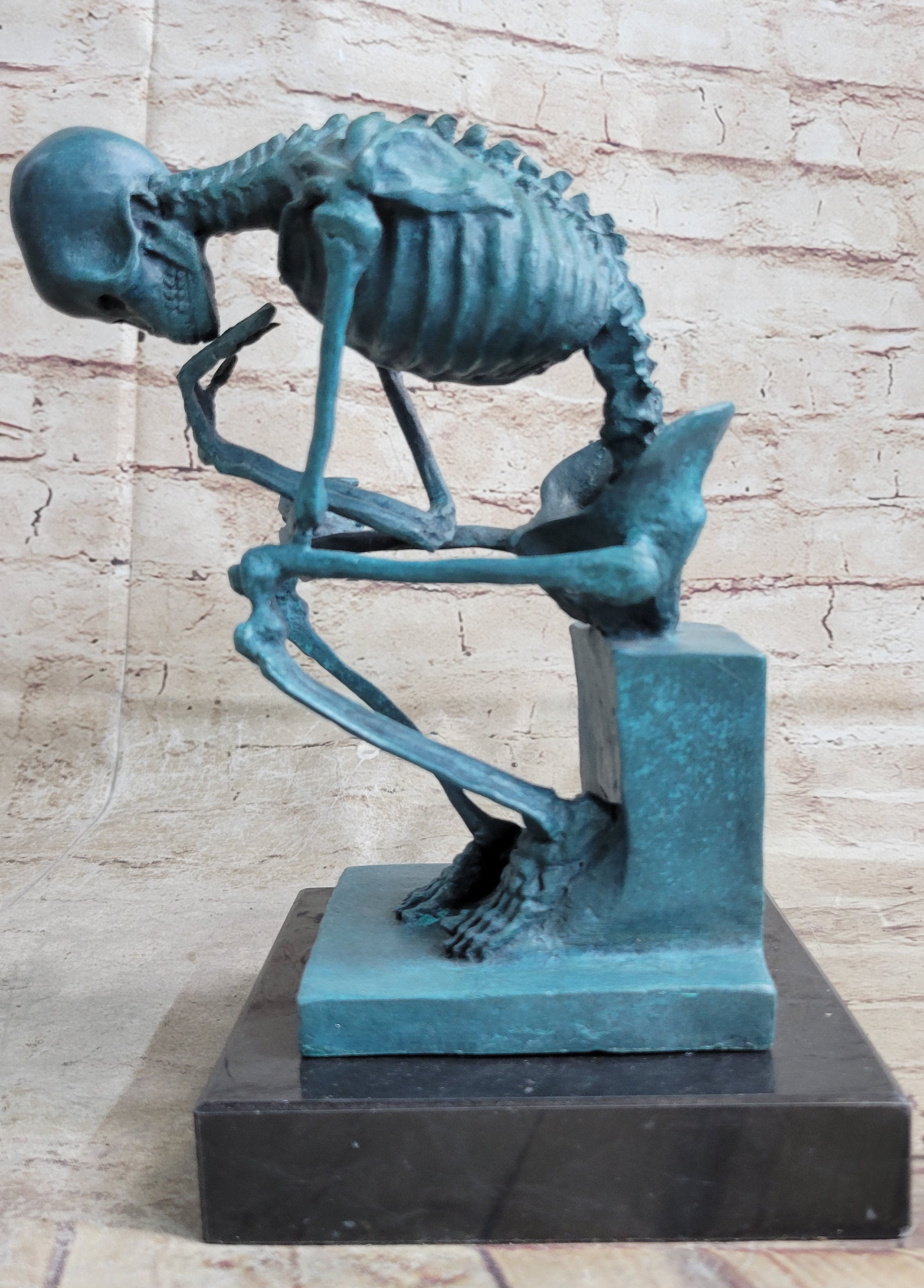 thinking figure statue