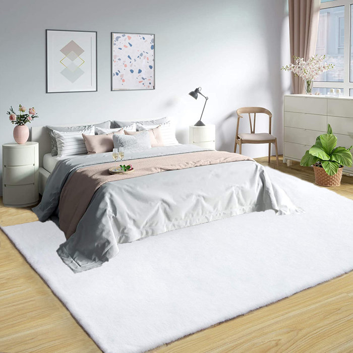 Mercer41 Fidenzia Solid Color Machine Woven Faux Fur Area Rug in White ...