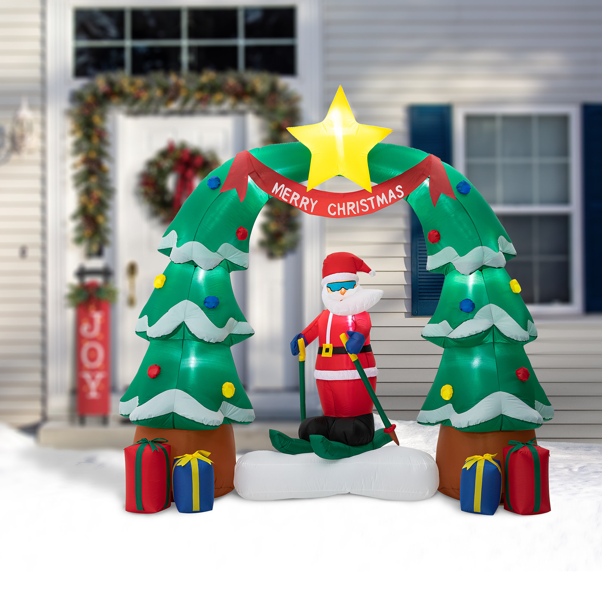 The Holiday Aisle® Lighted Inflatable Santa Skiing Under Tree Arch ...