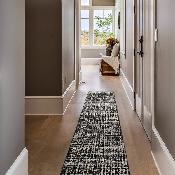 17 Stories Annetha Machine Tufted Polypropylene Black/Earth Tone Rug ...