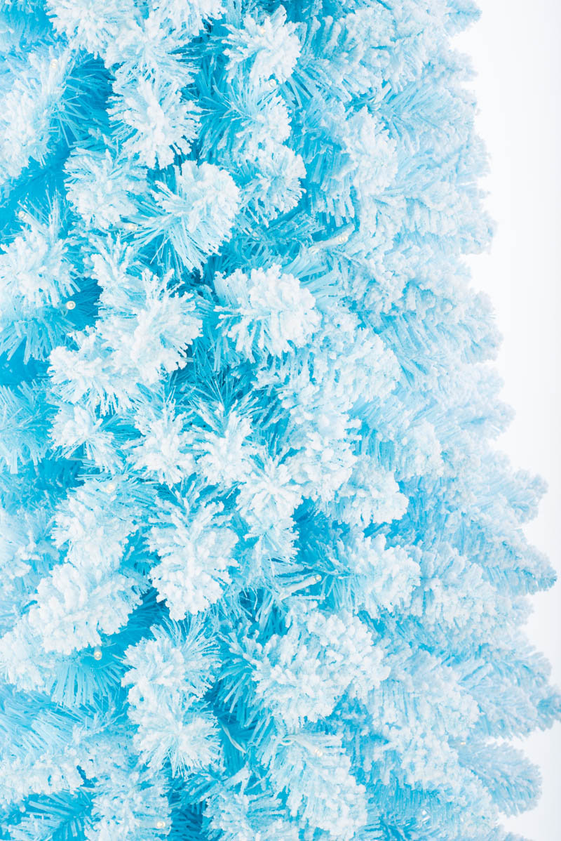 The Holiday Aisle® Flocked Sky Blue Plastic Fir Tree | Wayfair