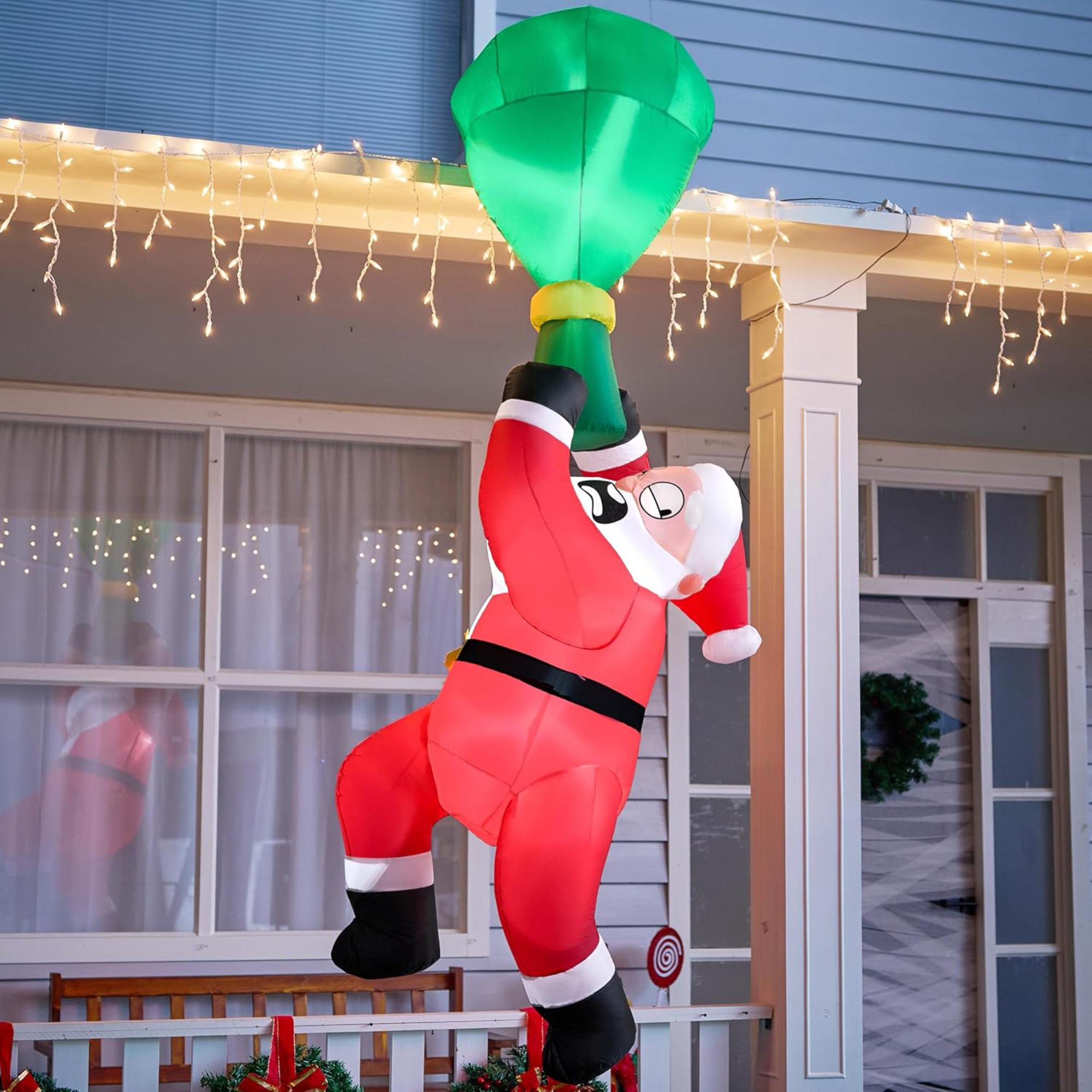 The Holiday Aisle® 8 FT Tall Christmas Inflatable Falling Santa With ...